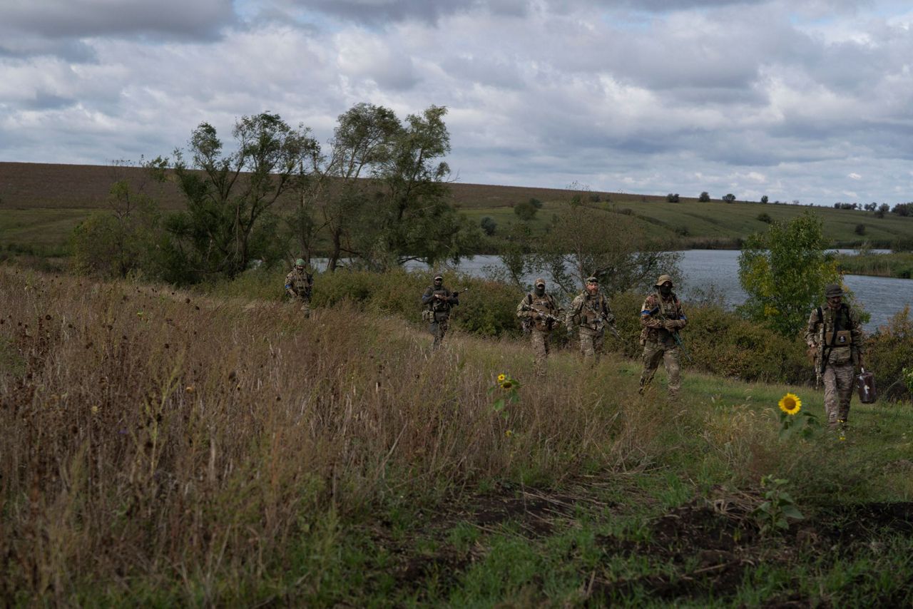 In Ukraine's retaken battlefields, soldiers recover bodies