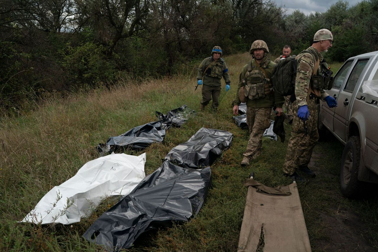 In Ukraine's retaken battlefields, soldiers recover bodies