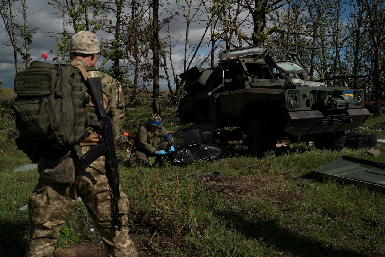 In Ukraine's retaken battlefields, soldiers recover bodies