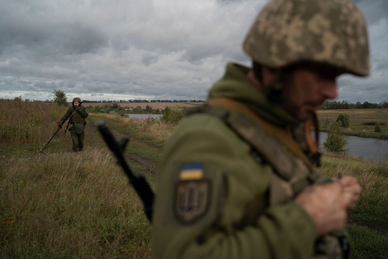 In Ukraine's retaken battlefields, soldiers recover bodies