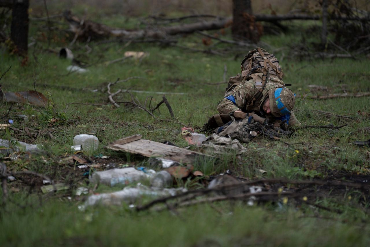 In Ukraine's retaken battlefields, soldiers recover bodies