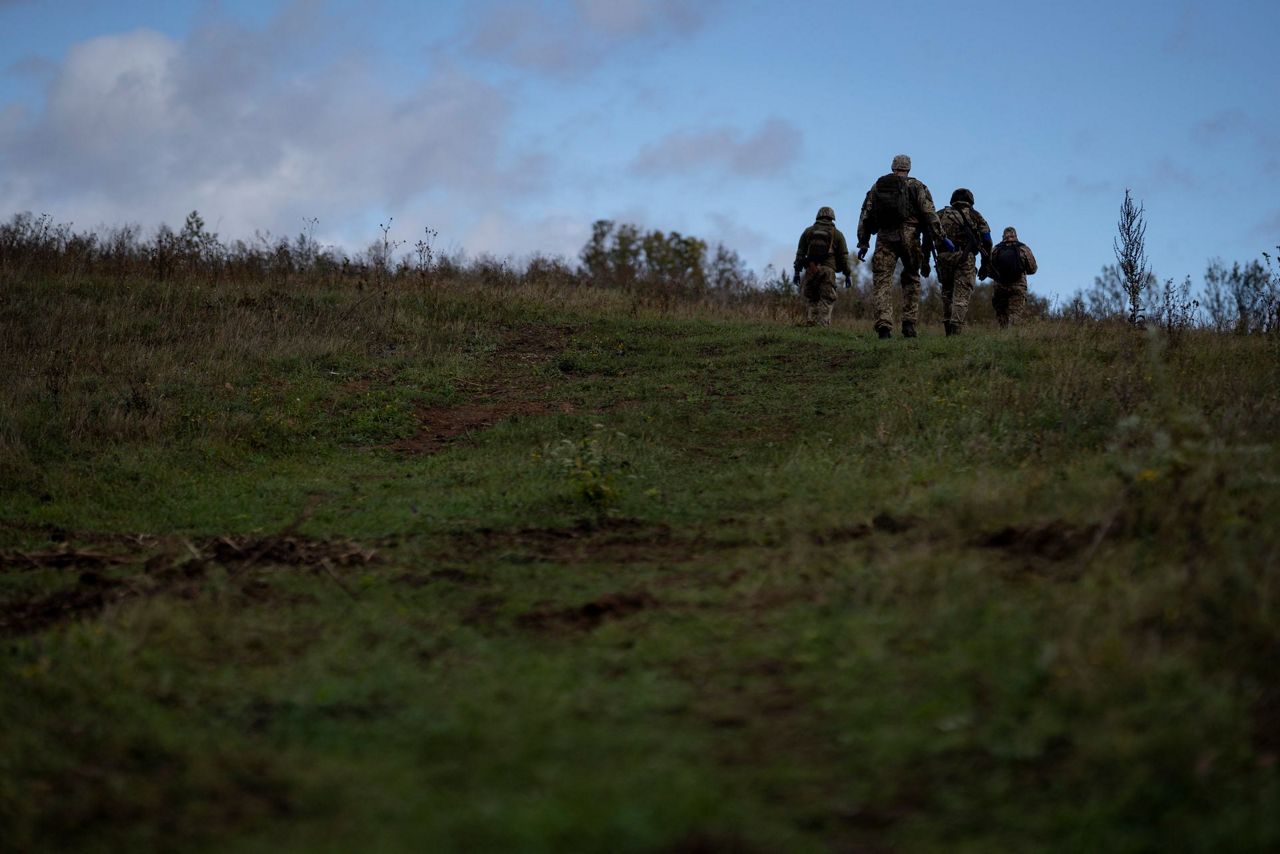 In Ukraine's retaken battlefields, soldiers recover bodies
