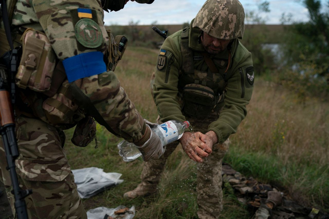 In Ukraine's retaken battlefields, soldiers recover bodies