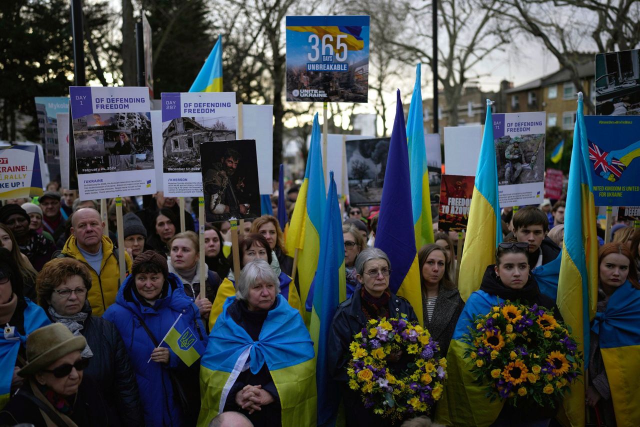 Wrecked Russian tank, skull and silence mark war anniversary