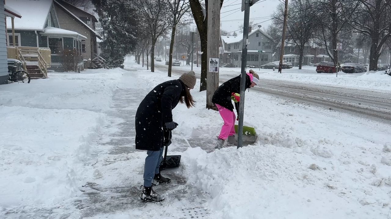 Residents clean up after snow storm