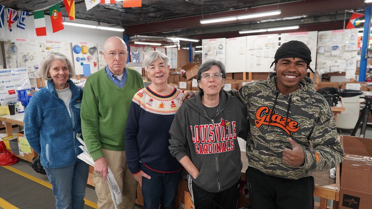 Louisville volunteers pack personal care kits for homeless