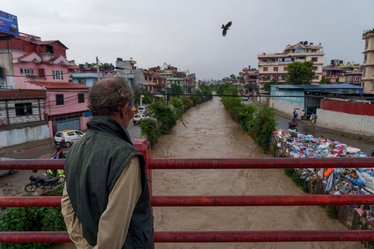 Nepal's holy Bagmati River choked with black sewage, trash