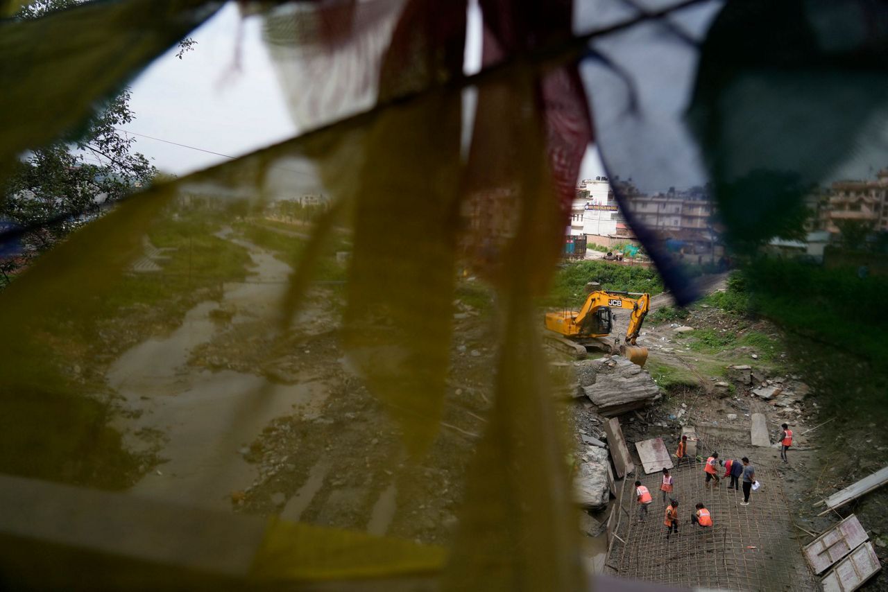 Nepal's holy Bagmati River choked with black sewage, trash