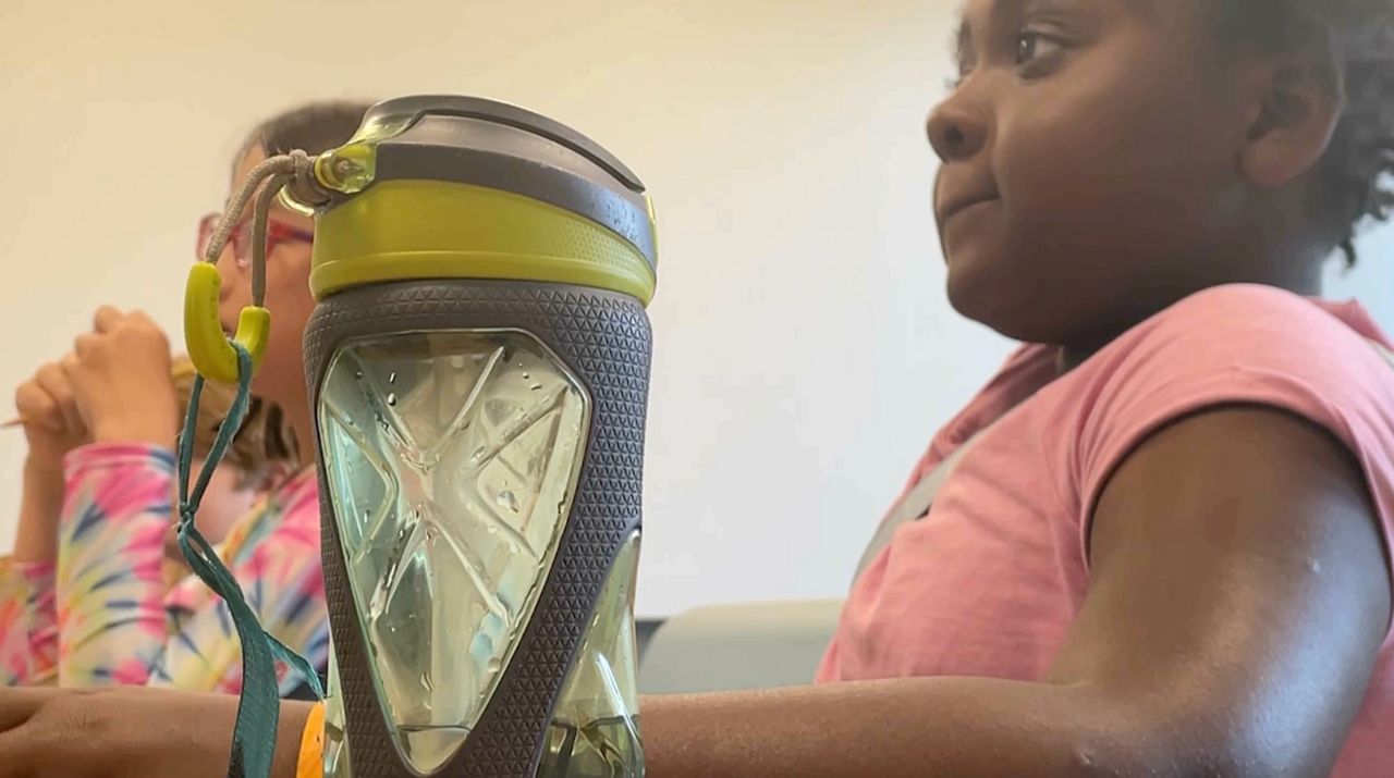 Instructor introduces first aid safety for kids