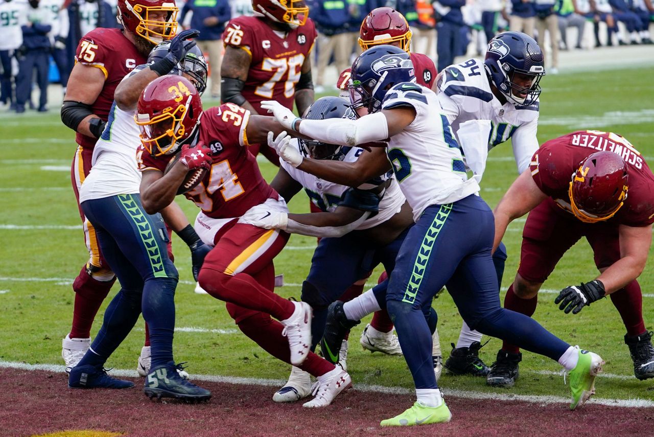 Seahawks hold on to beat Washington, clinch playoff spot
