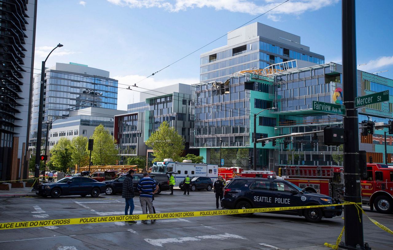 The Latest: Crane collapses in downtown Seattle, kills 4