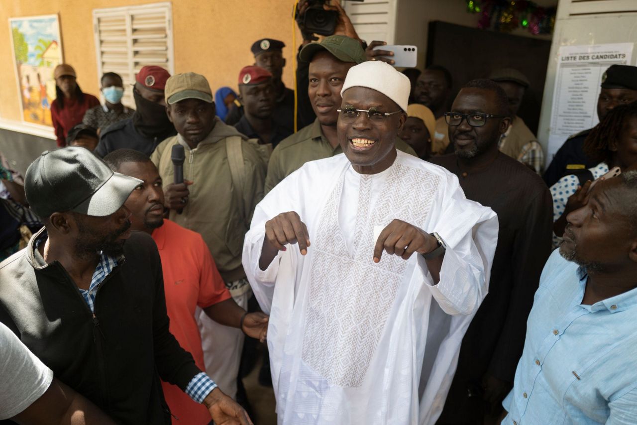 Senegal votes in a tightly contested presidential race after months of ...