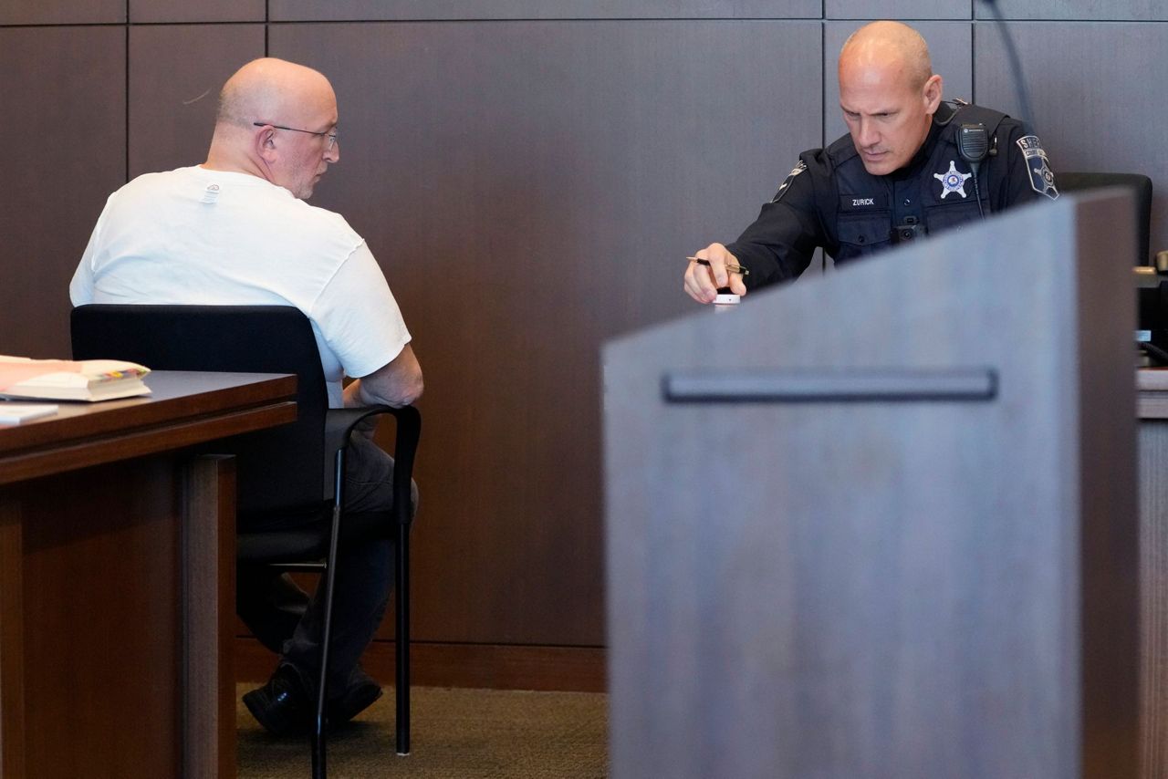 Father of July 4th parade shooting suspect turns himself in to begin ...