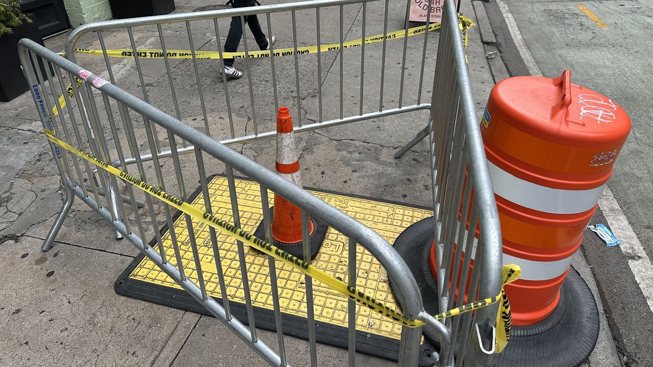 Crumbling sidewalk gives bird's-eye view of subway platform
