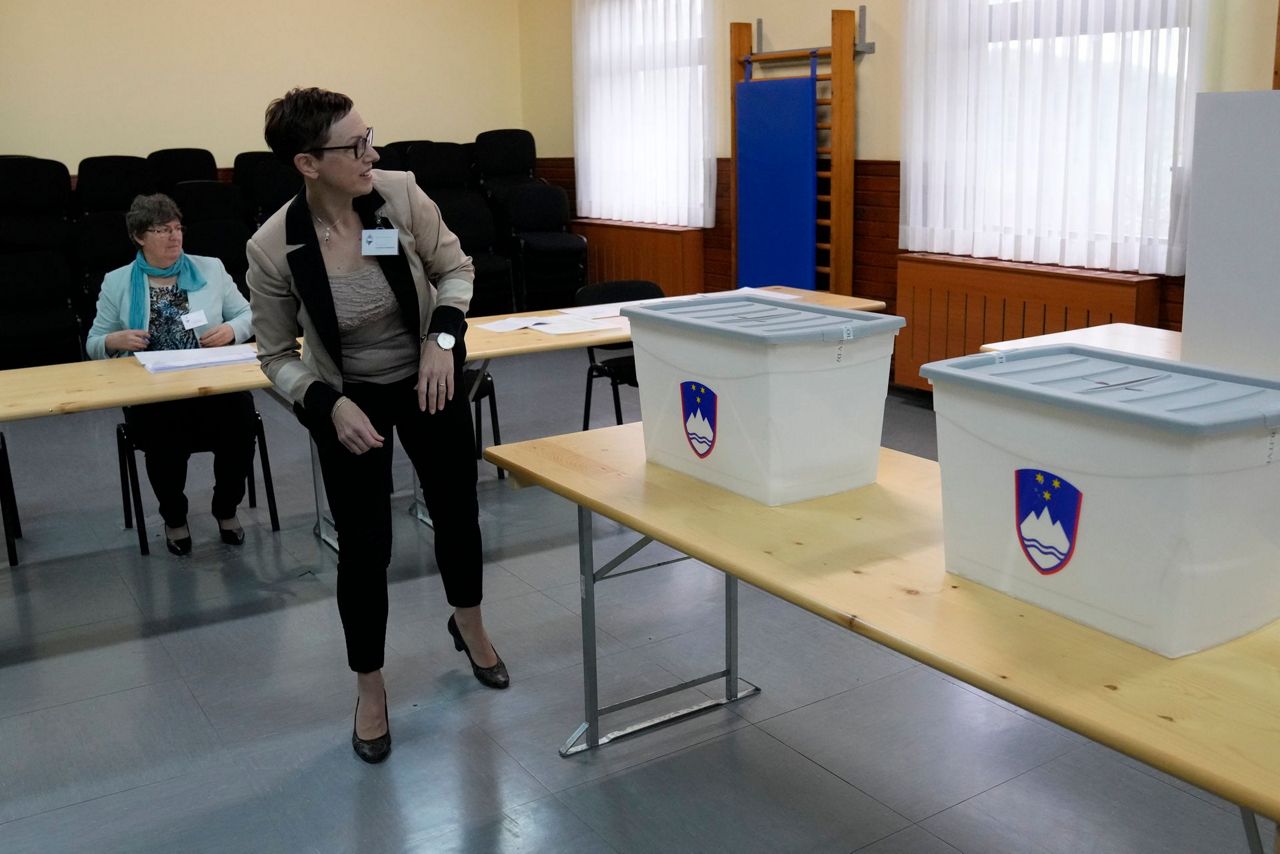 Slovenians vote in tight race between populists, liberals