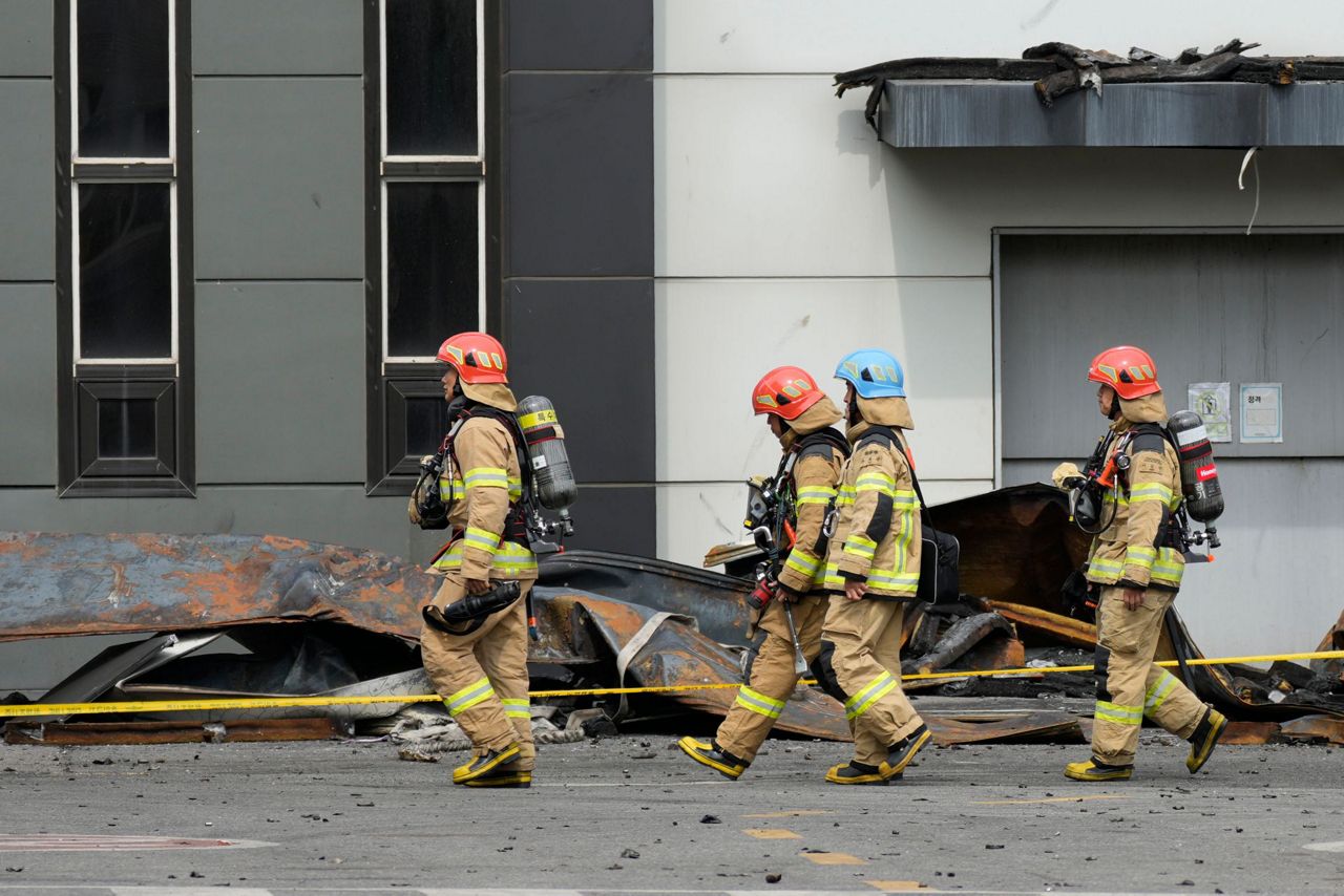 South Korean rescuers search burned factory after a blaze killed 22 ...