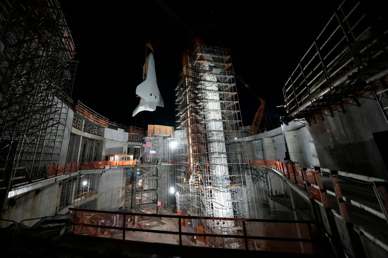 Space Shuttle Endeavour hoisted for installation in vertical display at ...