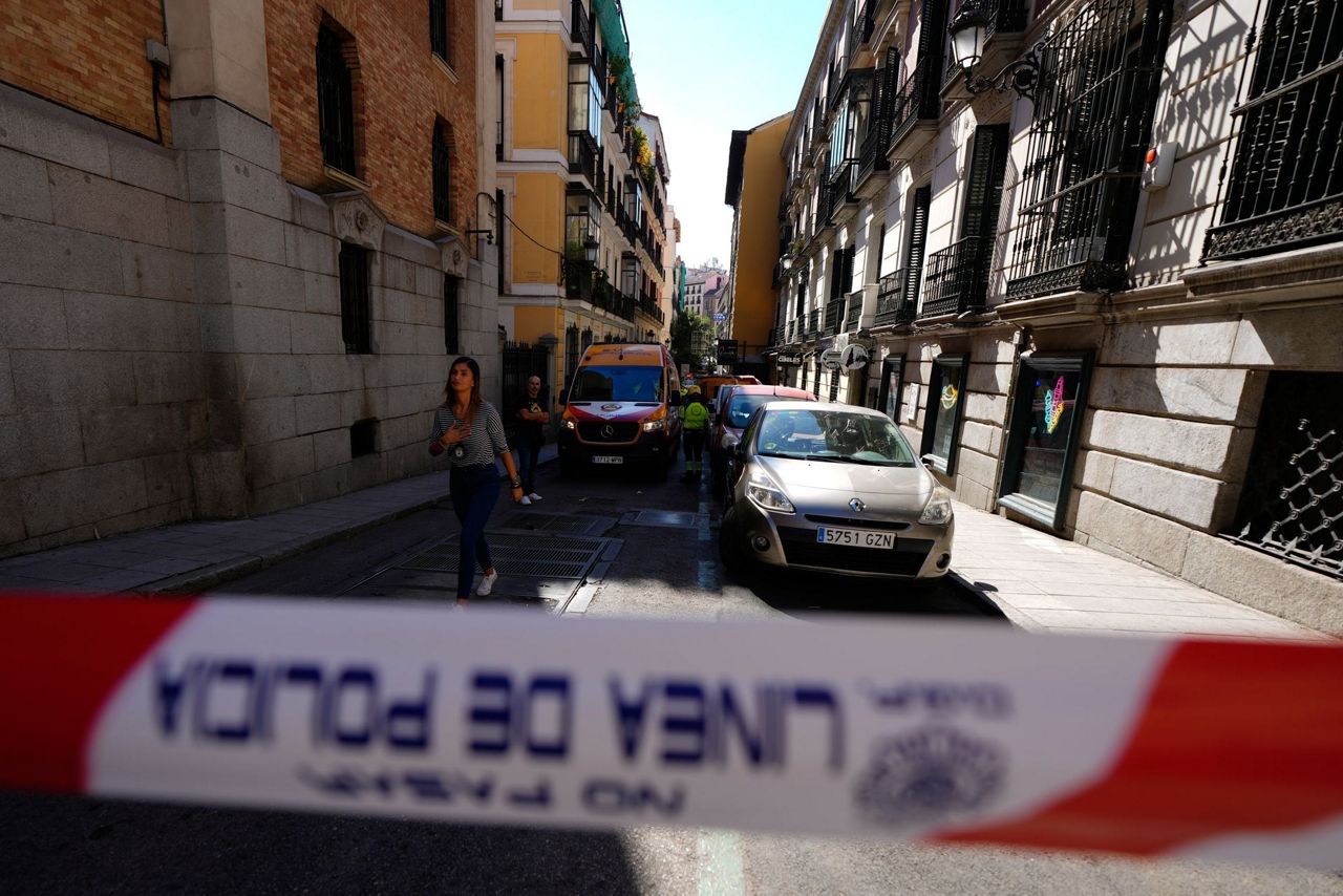Spanish firefighters respond to building collapse in Madrid