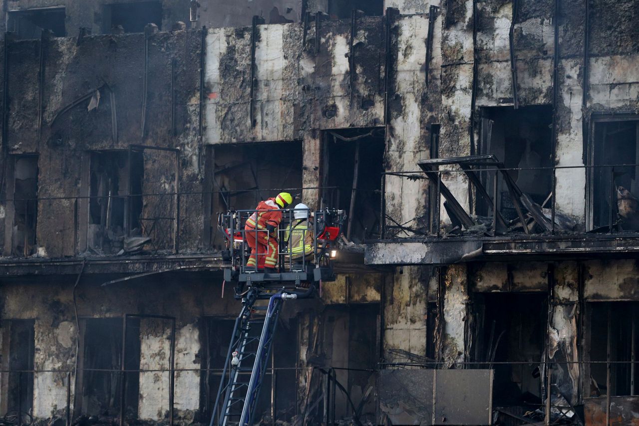 Rescuers search for 14 people missing after apartment block fire in ...