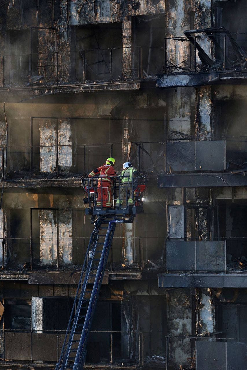 Rescuers search for 14 people missing after apartment block fire in ...