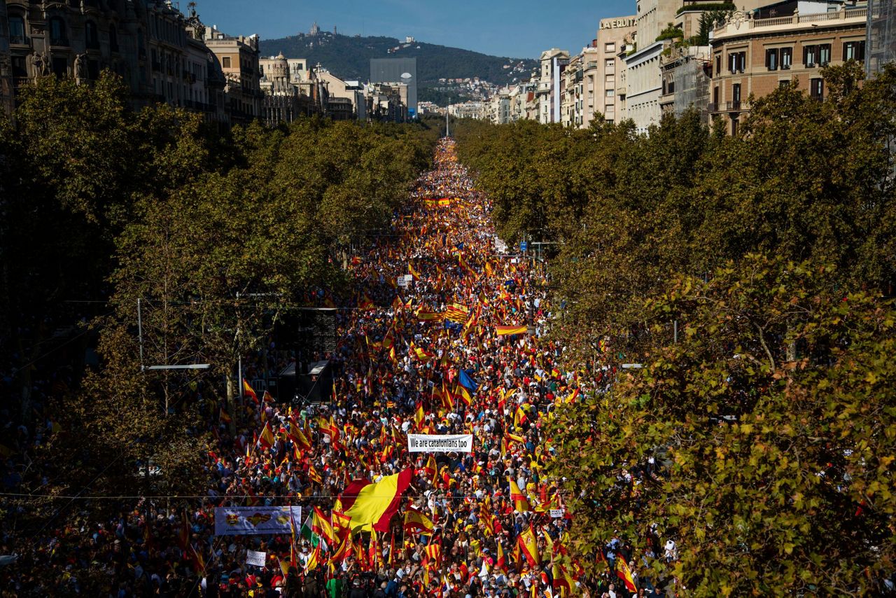 Tens of thousands march in Barcelona urging Spanish unity