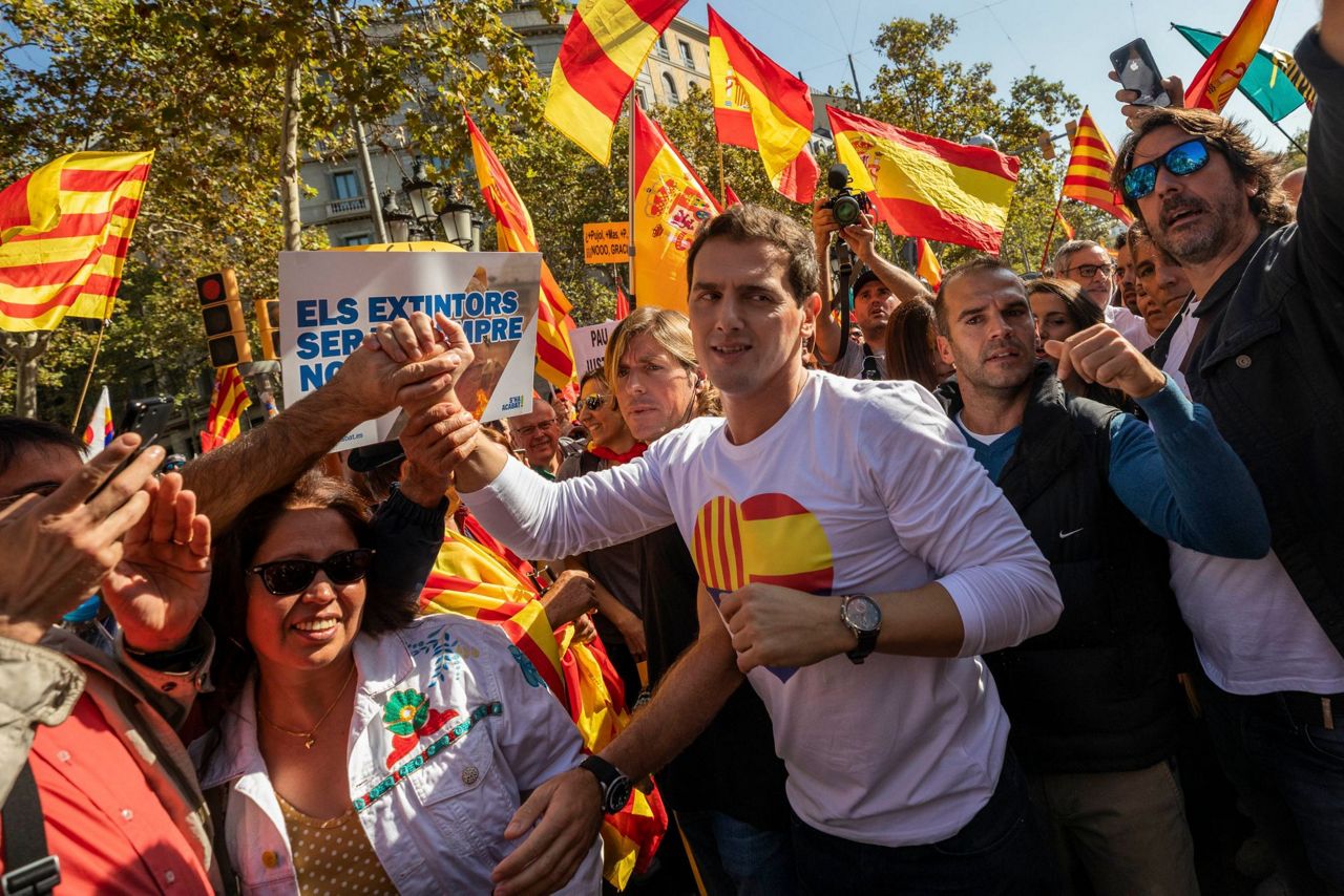 Tens of thousands march in Barcelona urging Spanish unity
