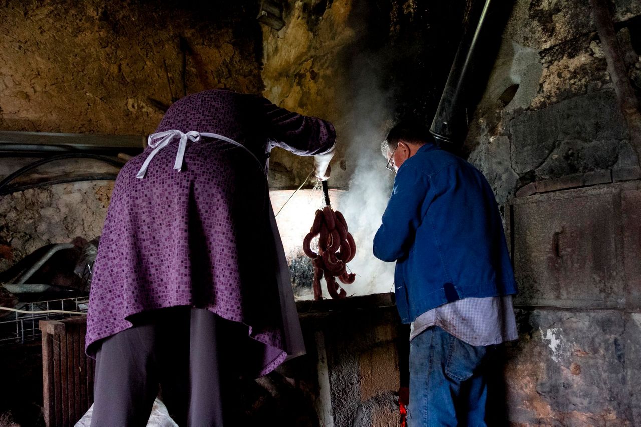 Tradition of open-air pig slaughter abides on Spanish island