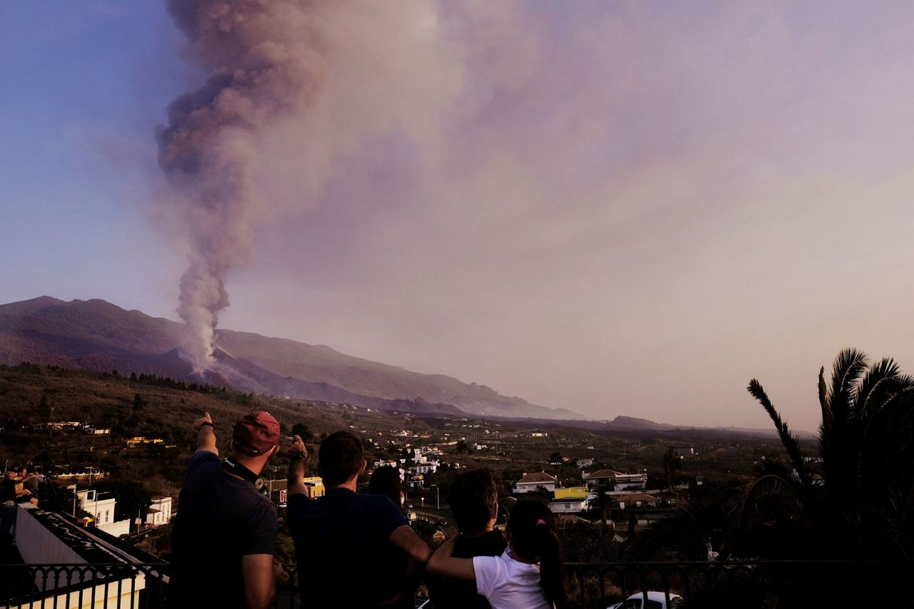 Lava from Spanish volcano surges after crater collapse