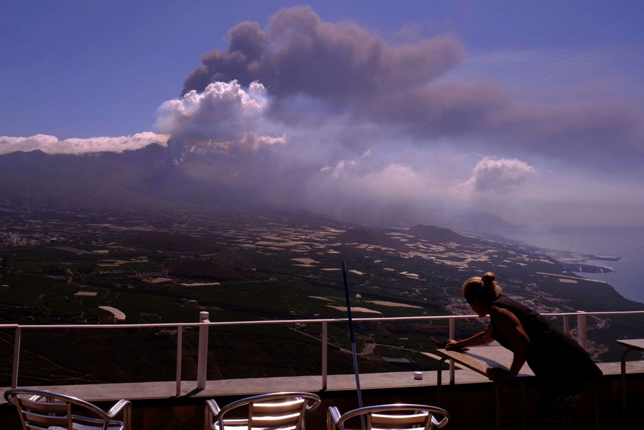 Lava from Spanish volcano surges after crater collapse