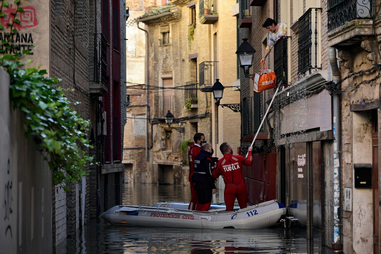 At least 1 dead as swollen rivers flood streets in Spain
