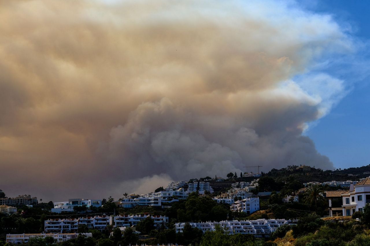 Spain evacuates 2,000 people as crews race to check wildfire