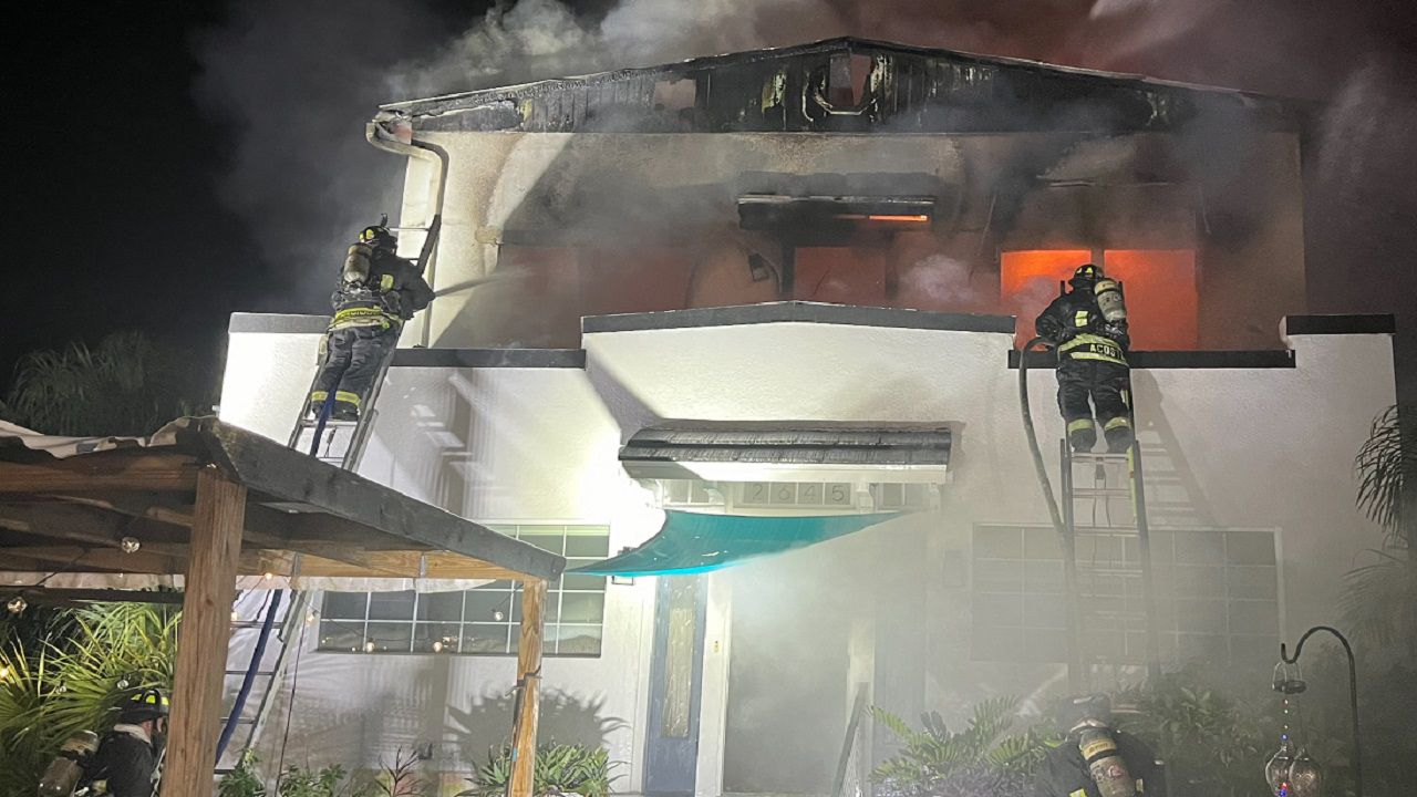 Firefighters rescue mom and daughter from burning bungalow