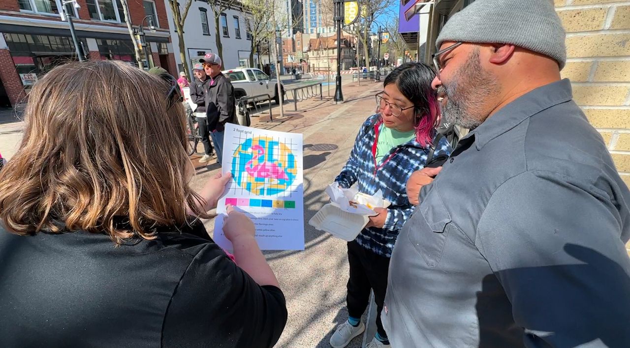 Over 600 people create street art on State Street in Madison