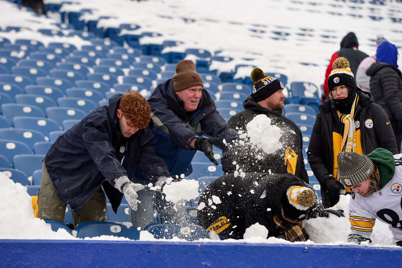 Sun is out and crews are busy digging out snow-covered stadium for Bills' playoff game vs. Steelers