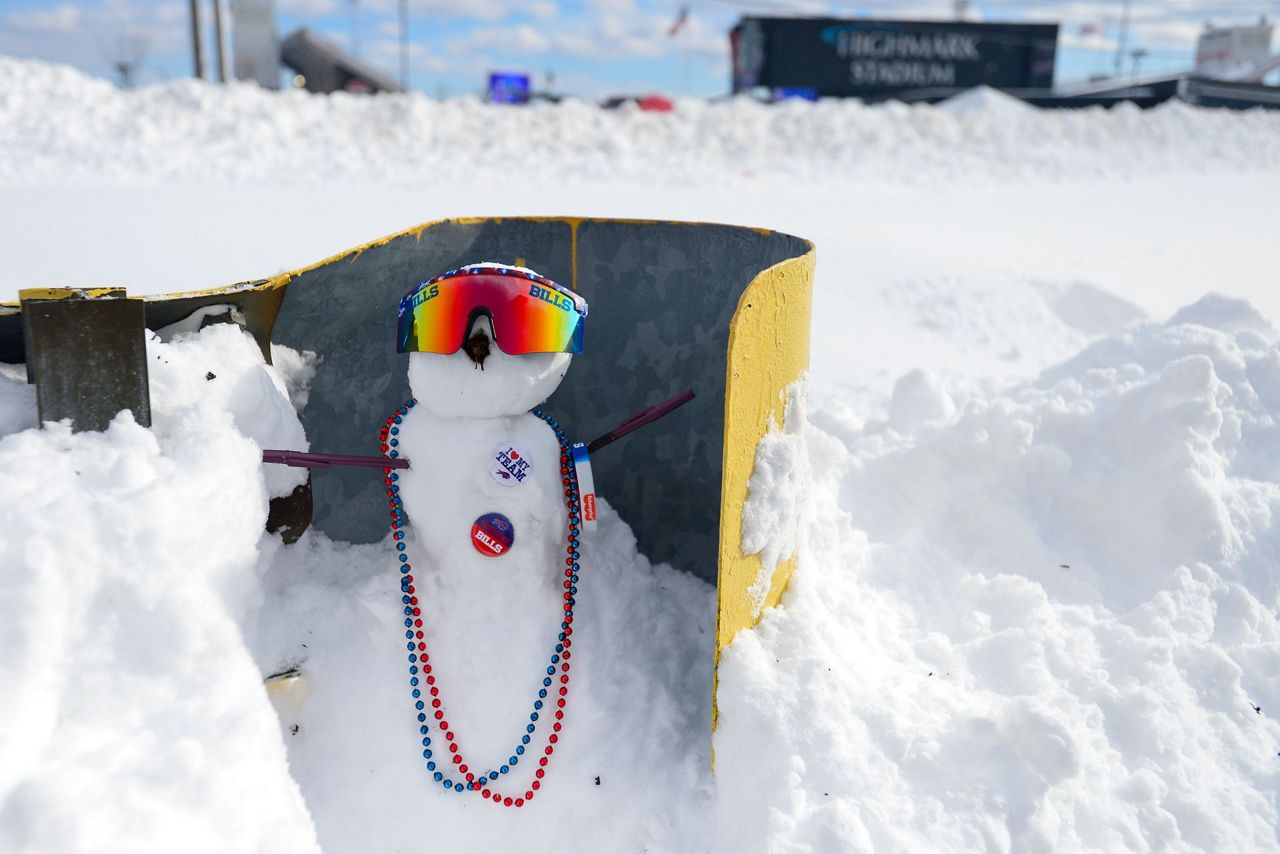 Sun is out and crews are busy digging out snow-covered stadium for ...