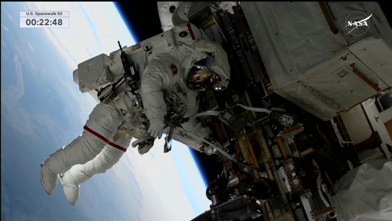 NASA's 2 stuck astronauts take their first spacewalk together