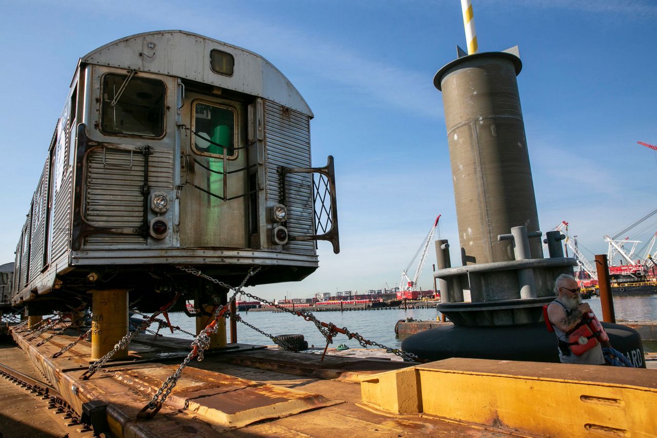 Bon voyage: Old subway cars float off across New York Harbor