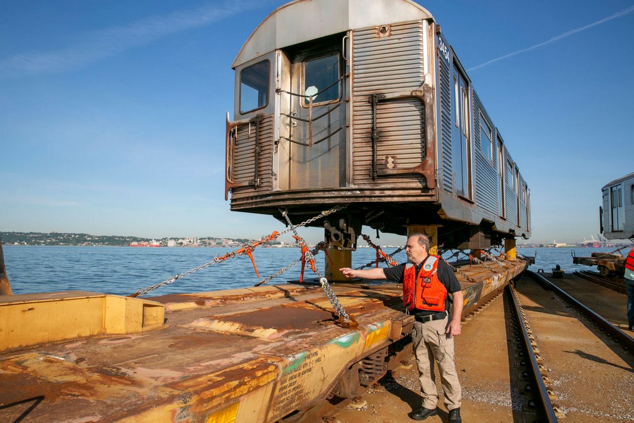 Bon voyage: Old subway cars float off across New York Harbor