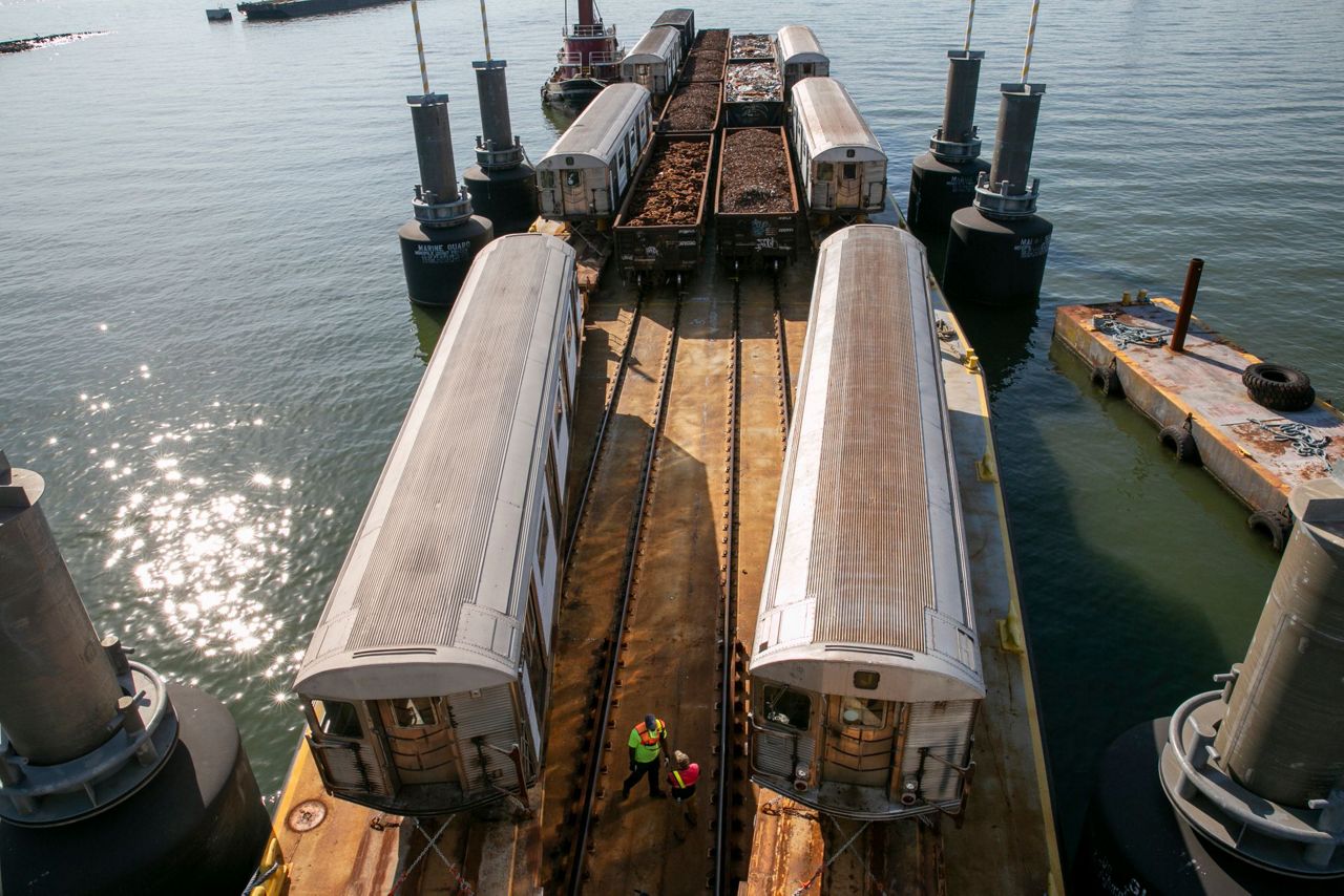 Bon voyage: Old subway cars float off across New York Harbor