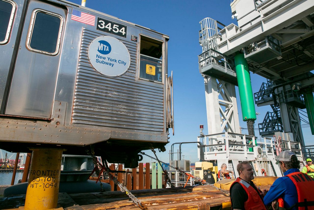 Bon voyage: Old subway cars float off across New York Harbor