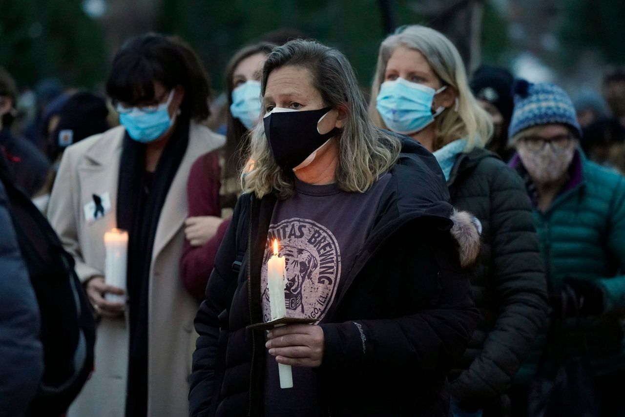 2,000 honor Boulder shooting victims; suspect hears charges