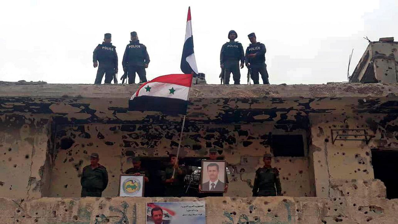 Syrian army, police celebrate recapturing all of Damascus