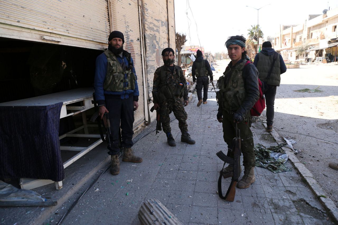 Syrian opposition fighters retake key town from government