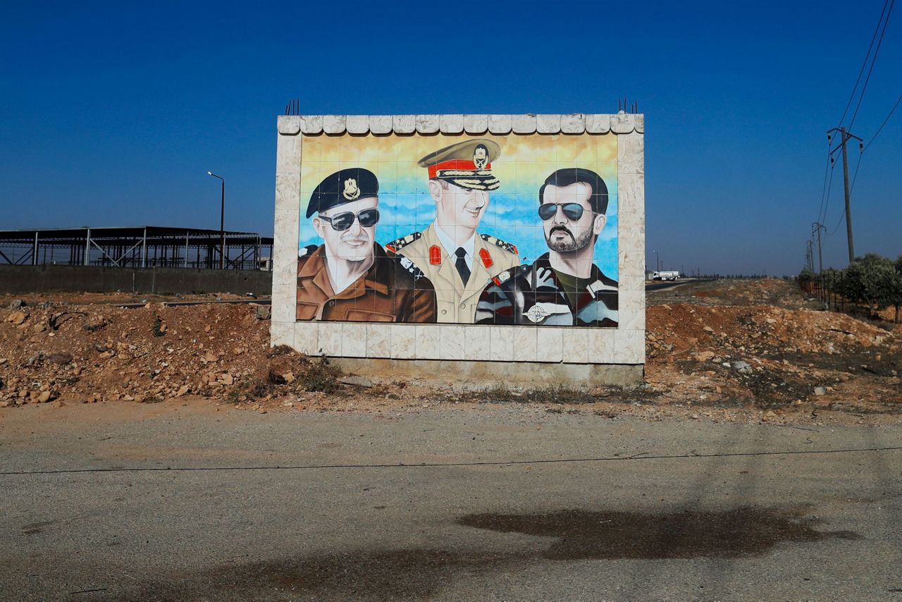 AP PHOTOS: Assad's victory posters crowd Damascus streets
