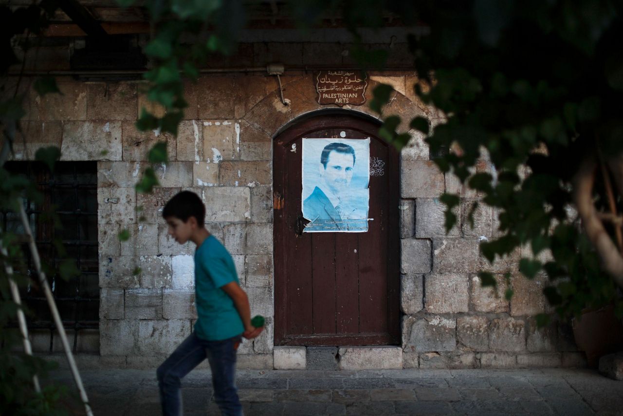 AP PHOTOS: Assad's victory posters crowd Damascus streets