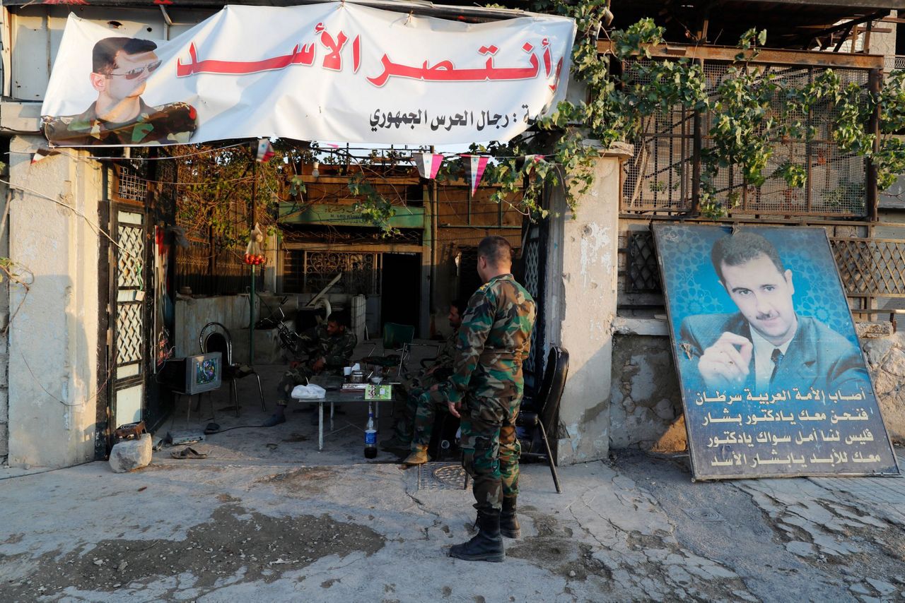 AP PHOTOS: Assad's victory posters crowd Damascus streets