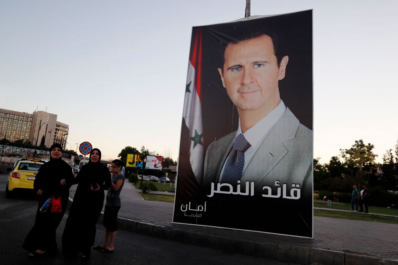 AP PHOTOS: Assad's victory posters crowd Damascus streets