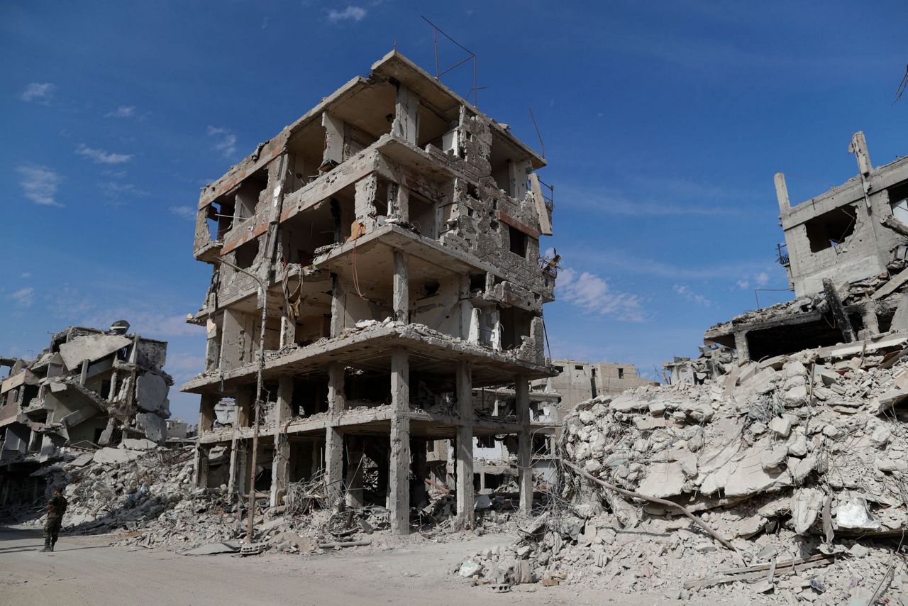 AP PHOTOS: Clearing the rubble in Syria's Yarmouk camp