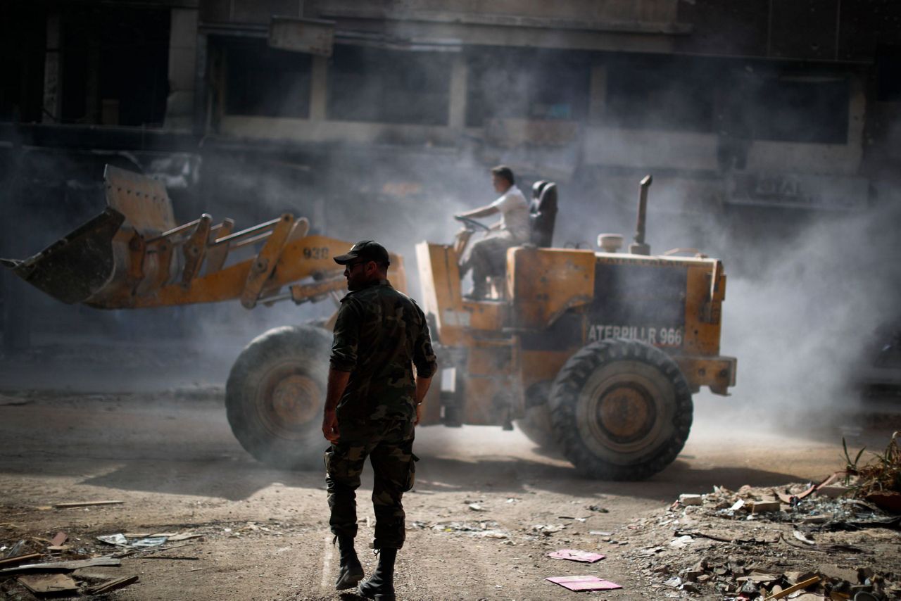AP PHOTOS: Clearing the rubble in Syria's Yarmouk camp