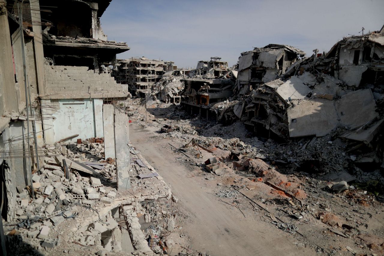 AP PHOTOS: Clearing the rubble in Syria's Yarmouk camp